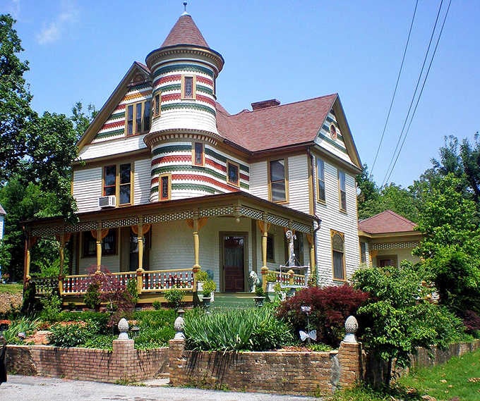 Victorian architecture meets whimsical charm in this candy-striped tower that looks straight out of a storybook illustration.