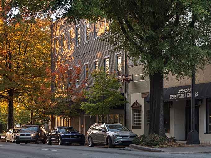 Golden hour lights up Main Street like a movie set, with trees shading sidewalks perfect for strolling.