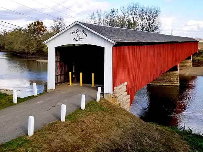 Those yellow bollards guarding the entrance add a cheerful modern touch to this vintage architectural treasure.