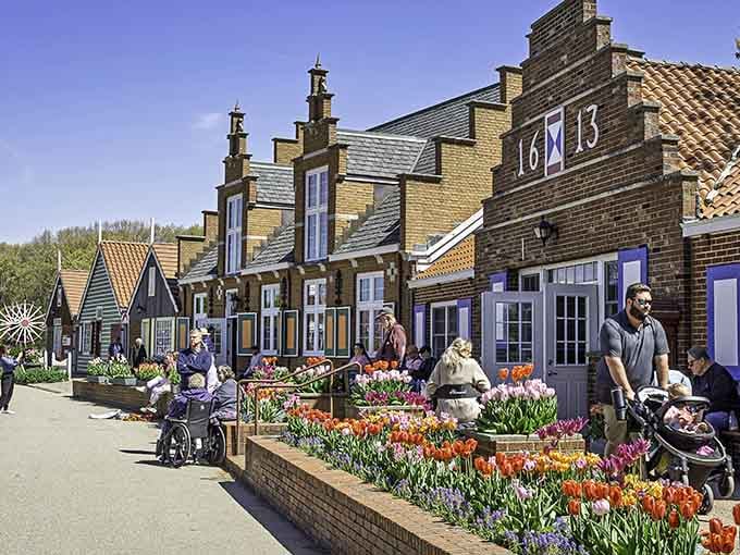 Tulips explode in a riot of color while visitors stroll past, proving spring really is worth waiting for.
