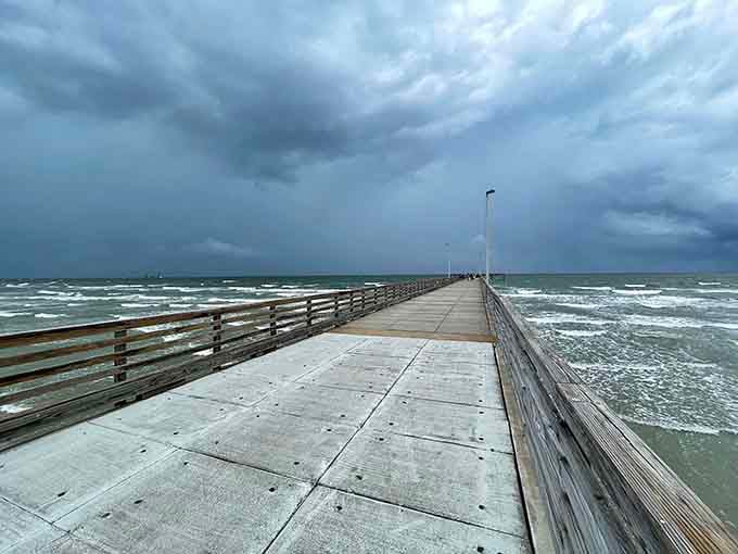 Even storm clouds can't dampen the drama of this pier stretching boldly into the churning Gulf waters.