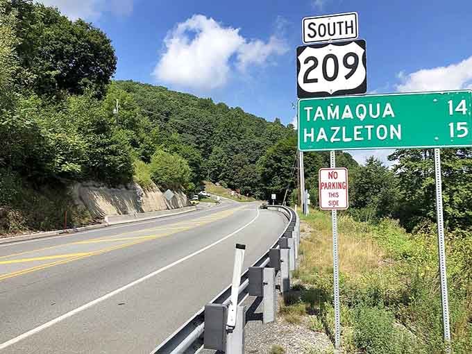 The scenic highway curves through lush green mountains, promising discoveries around every bend like a choose-your-own-adventure book come alive.