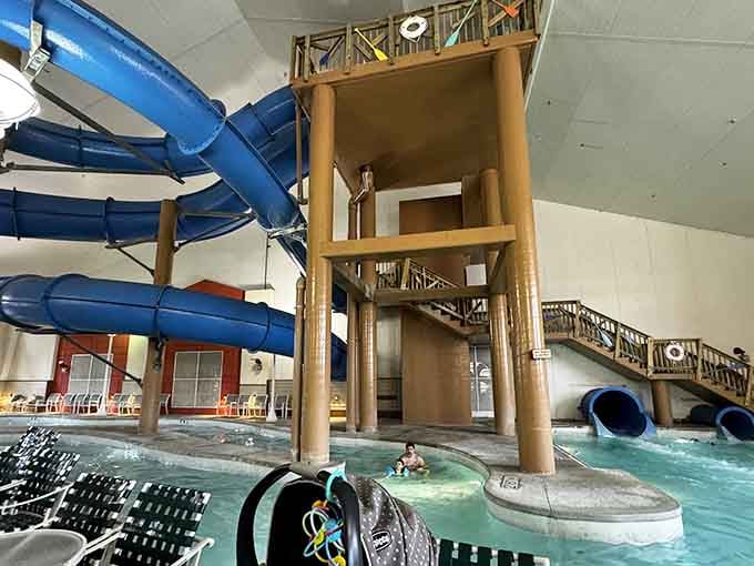 The wooden tower structure gives this indoor water park a treehouse vibe that makes getting wet feel like an adventure.