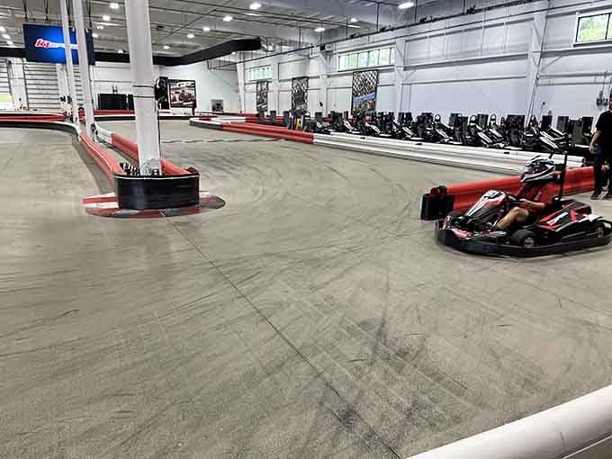 Rows of waiting karts stand ready like eager racehorses at the starting gate, engines humming with possibility.