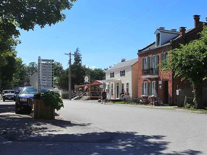 Dappled sunlight filters through the trees, illuminating this peaceful street frozen in time.