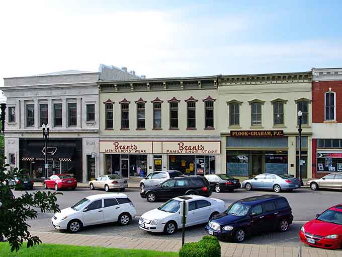 Angle-parked cars line streets where horse-drawn carriages once clip-clopped, blending yesterday with today beautifully.