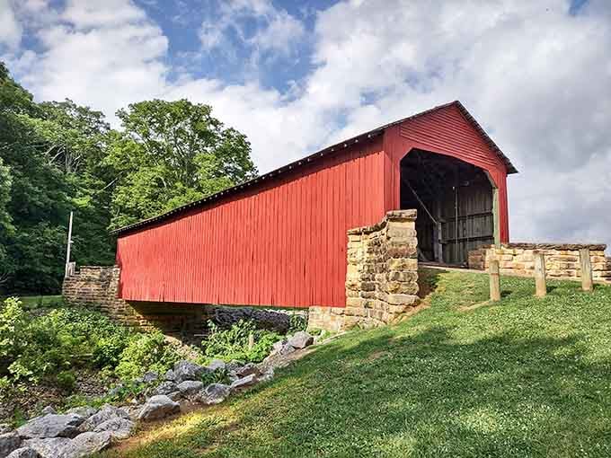 The side view reveals how perfectly this red bridge sits in the landscape, like it grew there naturally.