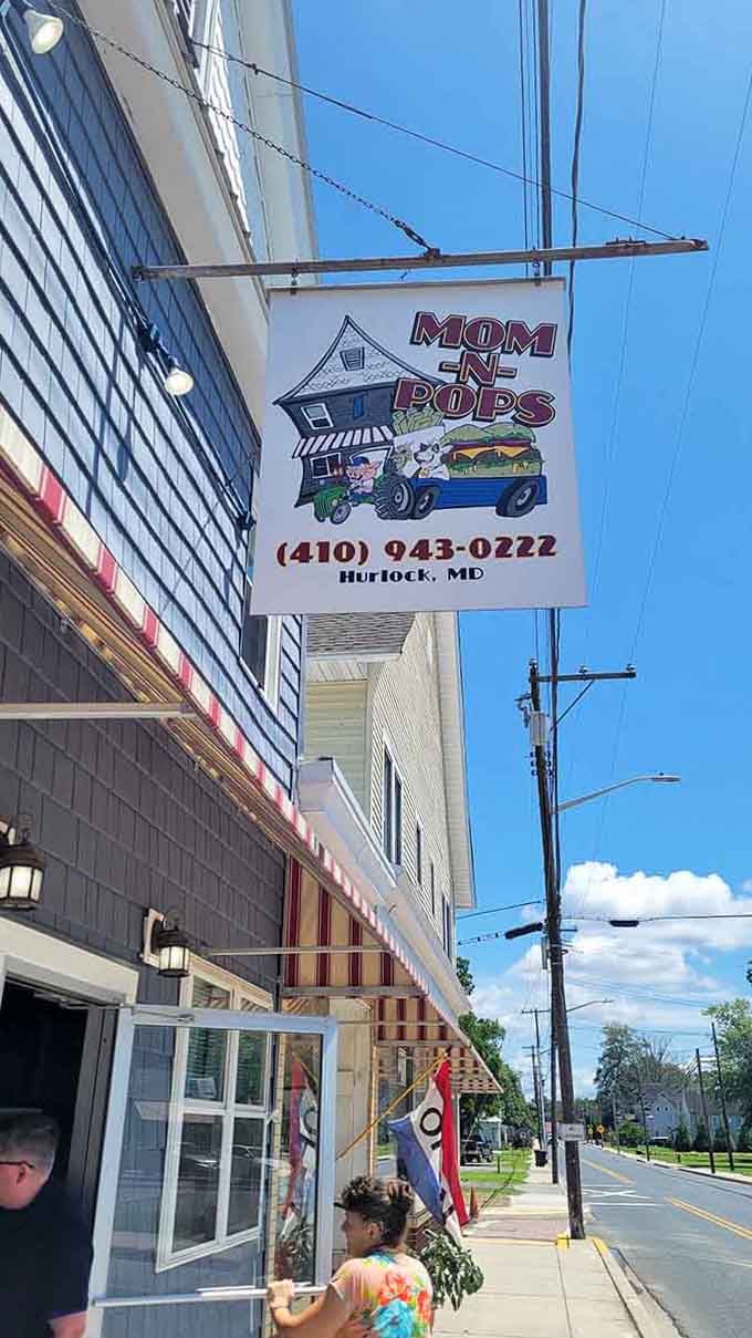 That vintage hanging sign swaying in the breeze guides hungry travelers to burgers and sandwiches made with genuine care.