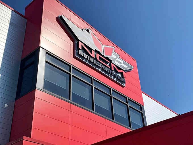 Bold red architecture announces this isn't your average entertainment spot; serious racing happens behind those modern walls today.