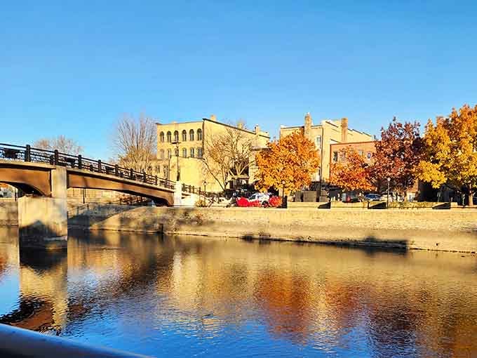 Fall colors dance on the river while century-old architecture watches over this peaceful waterfront like a faithful guardian.