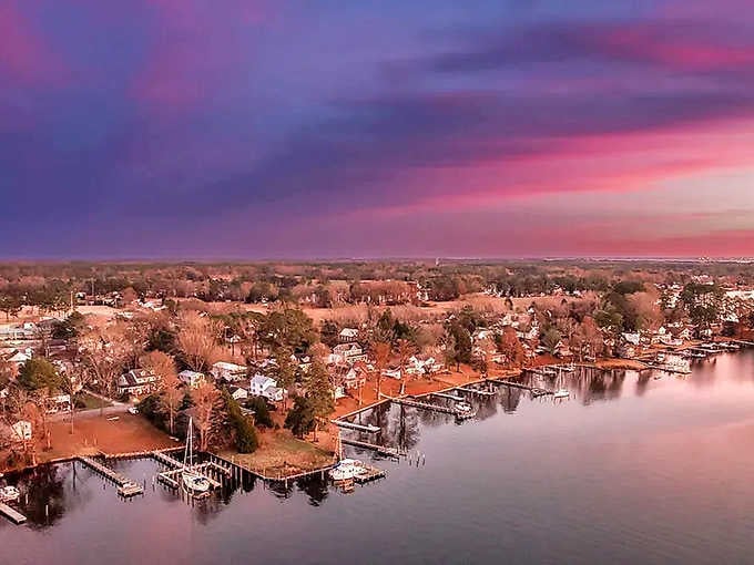 When the sky puts on a cotton-candy sunset show, coastal communities become the most beautiful theater seats available.
