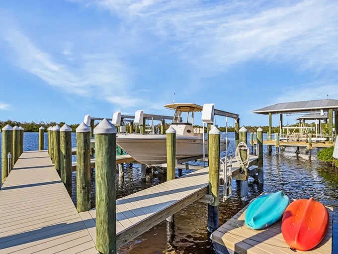 Private docks and colorful kayaks signal a lifestyle where every day begins and ends on the water.