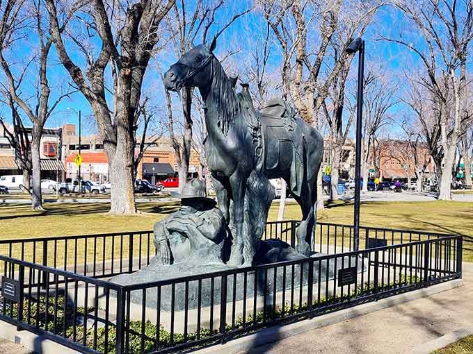 Winter sunlight filters through leafless trees, casting dramatic shadows across this monument to the frontier spirit that built these mountains.