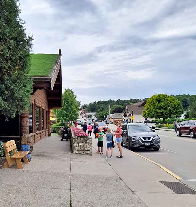 Families strolling past wooden buildings with flower boxes&mdash;this is what summer memories are made of.