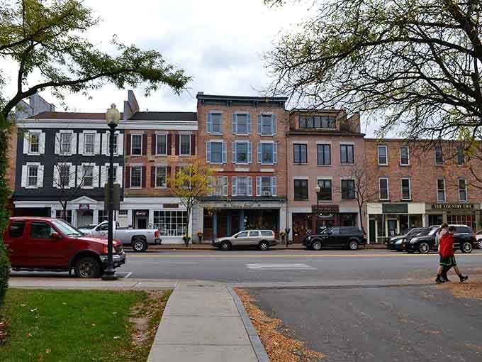 Historic brick buildings stand shoulder to shoulder like old friends gathered for a reunion that never really ends here.
