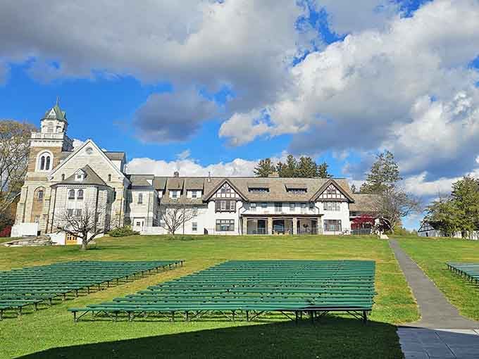 Rolling green lawns and stately buildings create an outdoor concert venue that feels both grand and intimate.