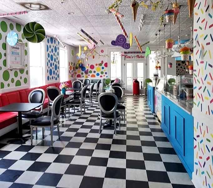The checkered floors and whimsical ceiling decorations transform this space into Willy Wonka's dream come true.