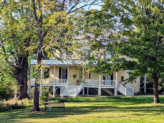 Mature trees frame this butter-colored mansion where an artist found his muse in every Hudson Valley sunset and shadow.