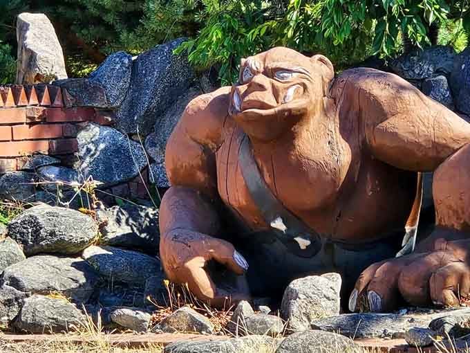 Bathed in golden sunlight, this massive guardian looks surprisingly peaceful for someone who could crush cars with one hand.