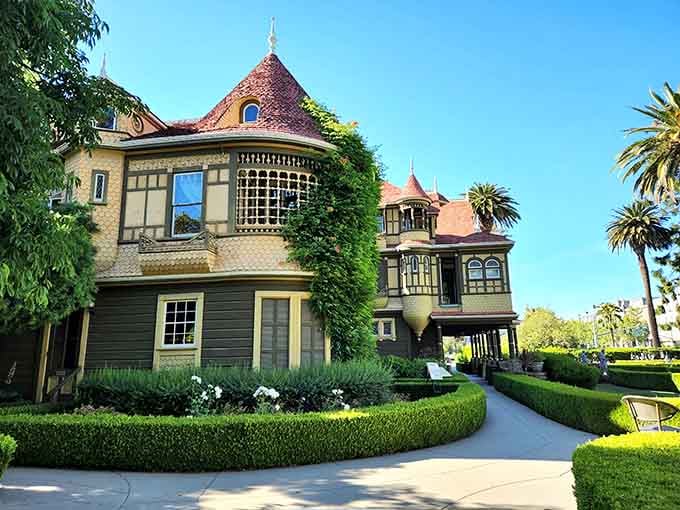 Ivy-draped walls and manicured hedges frame this architectural puzzle box where logic took a permanent vacation.