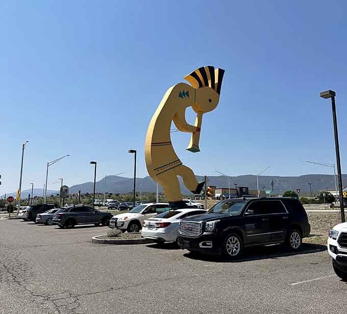 The World's Largest Kokopelli towers over the parking lot like a friendly giant welcoming travelers to town below.