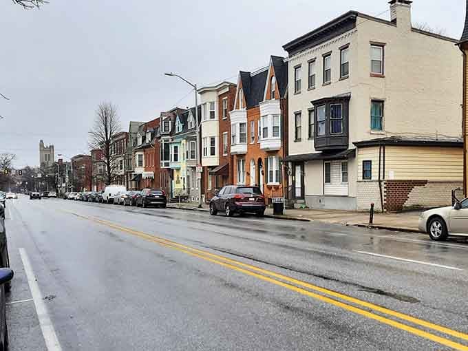 Colorful rowhouses line up in a soft mix of hues, proving affordable living doesn't mean sacrificing personality or neighborhood character at all.