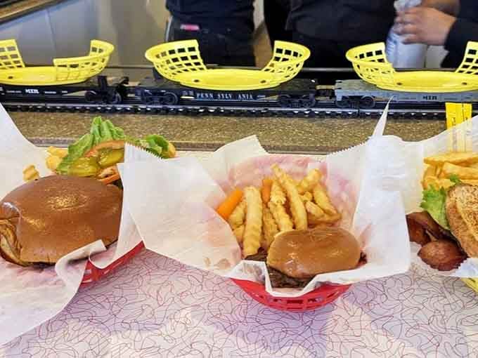 These grass-fed beef burgers arrive via overhead railway, making them taste even better than they look.