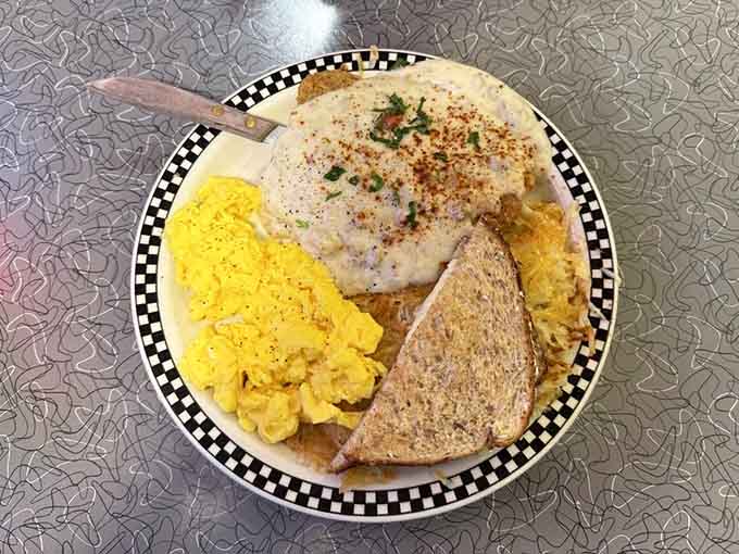 Chicken fried steak with fluffy eggs and golden toast on a checkered plate is breakfast done right, no apologies necessary.