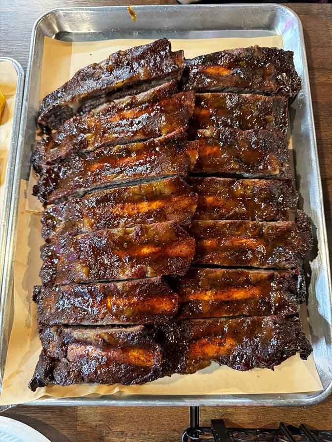 These ribs showcase that perfect bark and smoke ring that barbecue dreams are made of, no exaggeration needed.