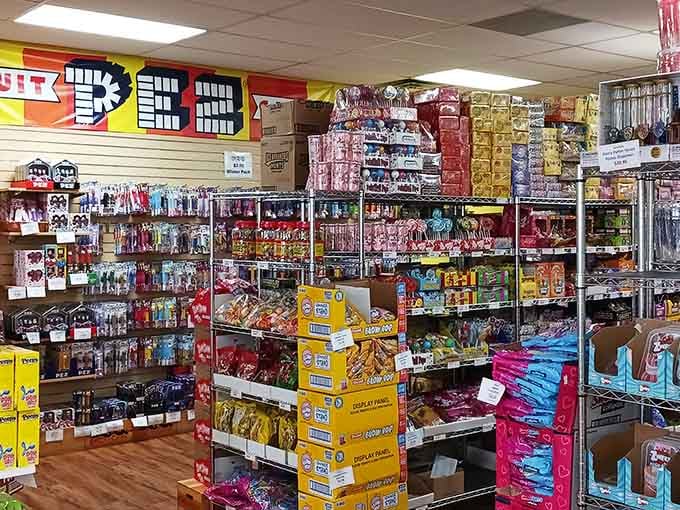 Industrial shelving packed with sugary treasures proves that warehouse chic works perfectly for candy storage and browsing dreams.