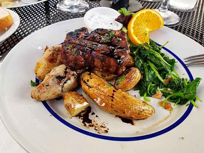 This beautifully plated steak arrives with roasted potatoes and greens, proving Gothic dining can be downright gorgeous.