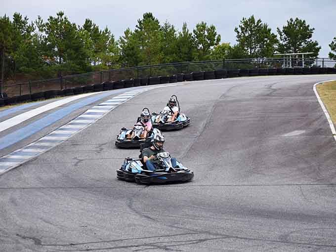 Three racers carving through corners in perfect formation, like a choreographed dance at 40 miles per hour.