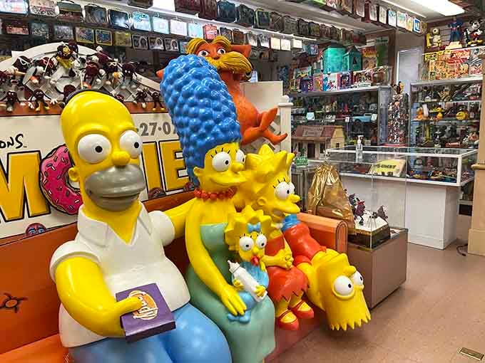 The Simpsons family sits ready to welcome visitors, forever frozen in their iconic couch gag glory.