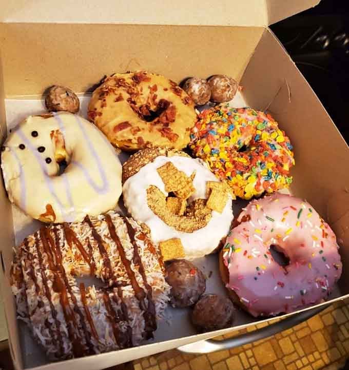 A box of assorted donuts that looks like edible art, each one more tempting than the last.