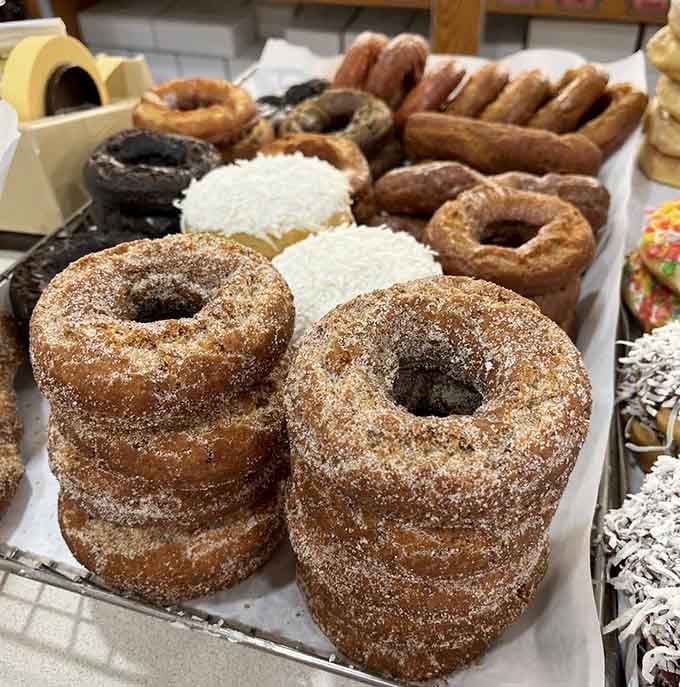 Cinnamon sugar donuts stacked like edible architecture, proving that sometimes the simplest pleasures are the most profound.