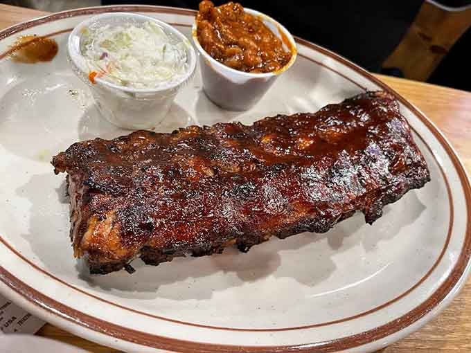 Baby back ribs glistening with sauce, flanked by coleslaw and beans&mdash;this is what happiness looks like on a plate.