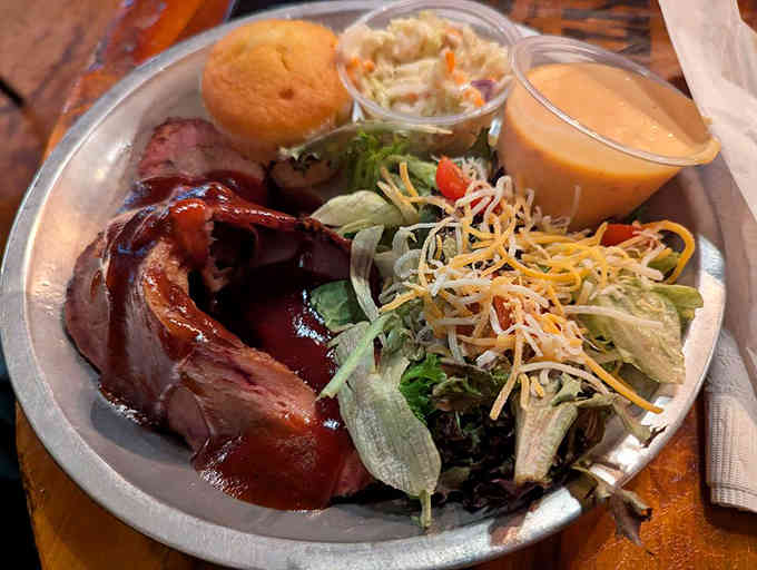 Brisket so tender it practically surrenders on your fork, served with all the fixings a cowboy could want.