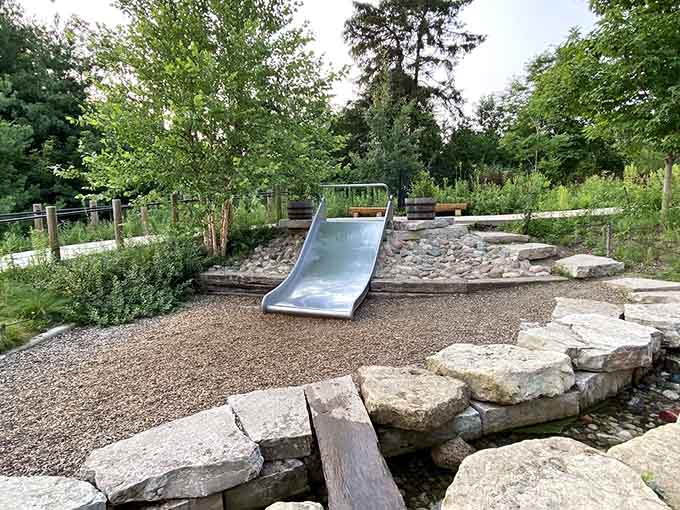 Slides built into natural hillsides prove the best playground designs work with the landscape instead of against it.