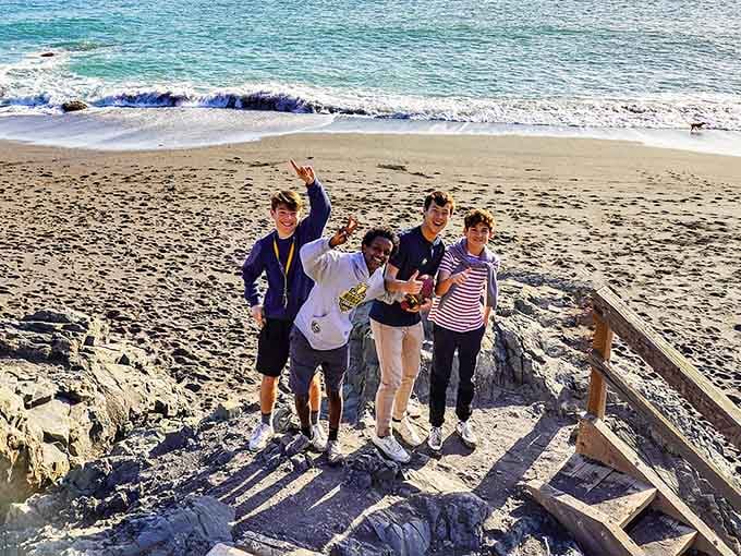 Nothing says friendship like conquering those stairs together and celebrating with peace signs on otherworldly shores.