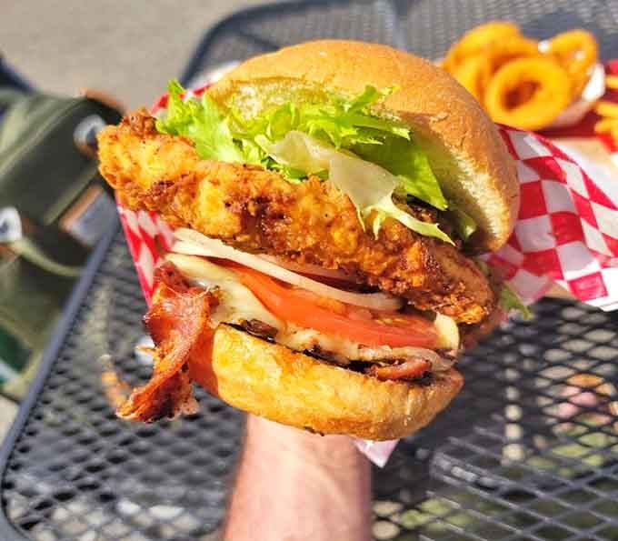 This fried chicken sandwich with bacon proves that sometimes the best things come stacked impossibly high.