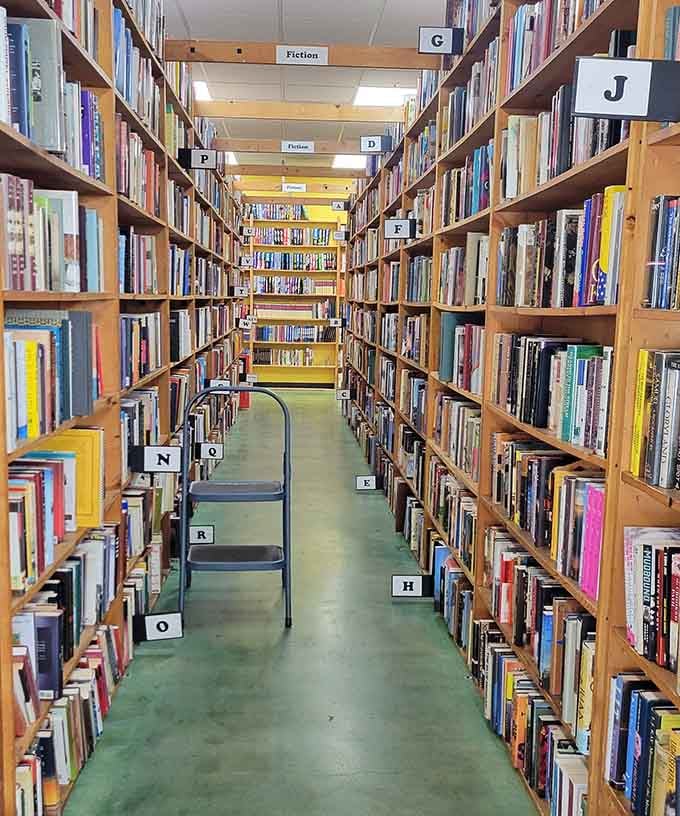 Fiction organized alphabetically because chaos is for the plot twists inside the books, not the shelves holding them.