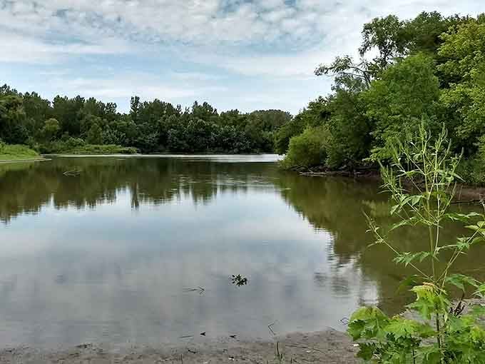 The Big Muddy's calm waters mirror the sky, creating a peaceful scene that invites quiet contemplation and reflection.