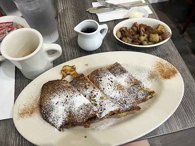French toast dusted with powdered sugar like fresh snow, proving that simple pleasures remain undefeated in the breakfast wars.