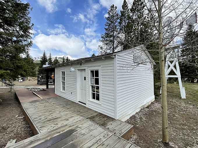 A simple white depot building reminds us that not every station needed marble columns to serve its purpose beautifully.