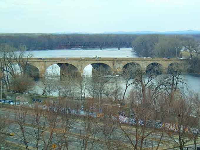 Stone arches spanning the river with the kind of confidence that only comes from nearly a century of experience.