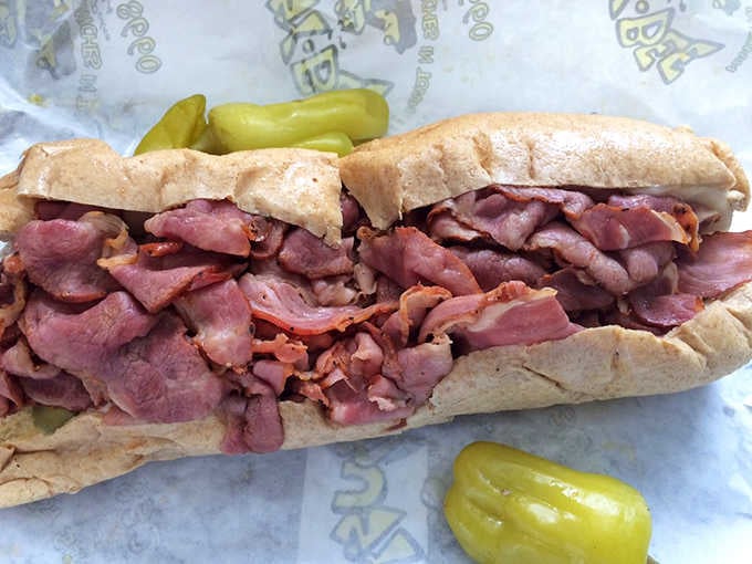 The pastrami sandwich arrives piled so high, you'll need an engineering degree to figure out the bite angle.