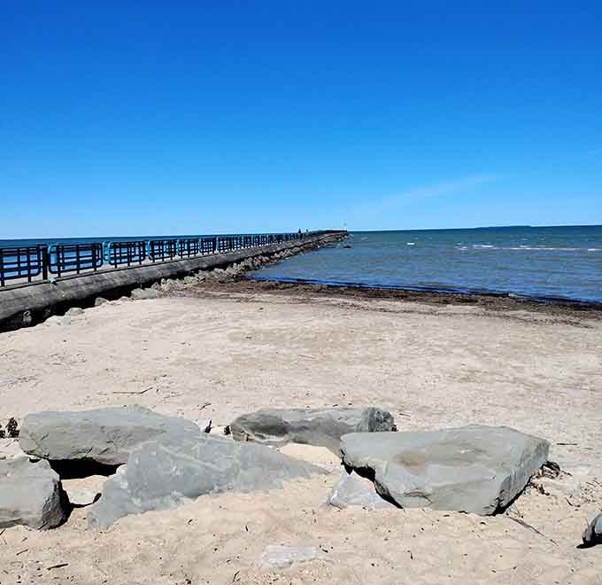 The pier extends into Saginaw Bay like a wooden highway to nowhere, perfect for contemplative walks and serious fishing.