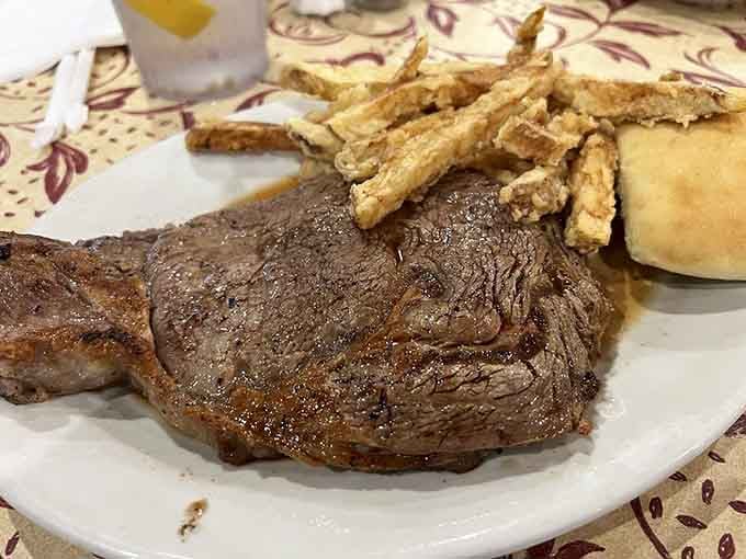 That perfectly cooked Delmonico with crispy fries proves why people drive miles for this place.
