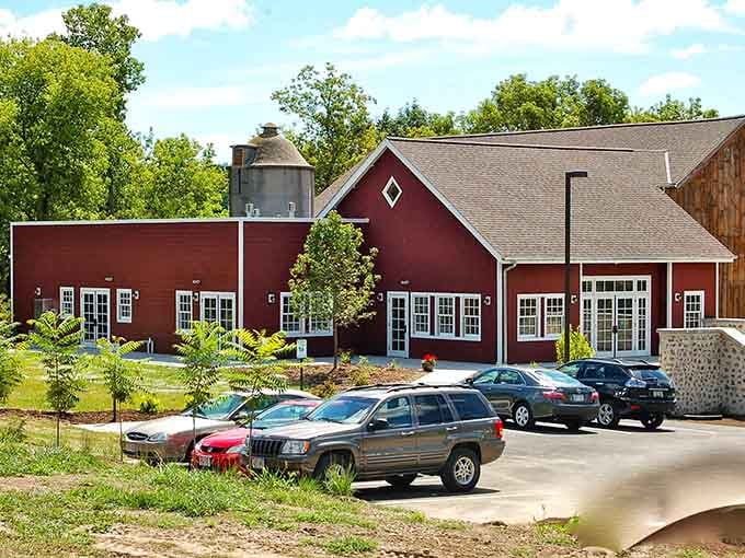 The red barn architecture proves that sometimes the best things come in packages that look like they belong on postcards.