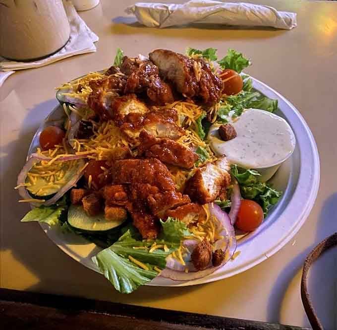Buffalo chicken meets fresh greens in this generous salad that somehow makes healthy eating feel like cheating.